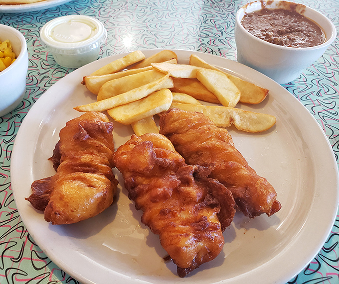 Golden-battered fish that crunches like autumn leaves, paired with fries that could make a Frenchman weep with joy. Simple perfection needs no passport.