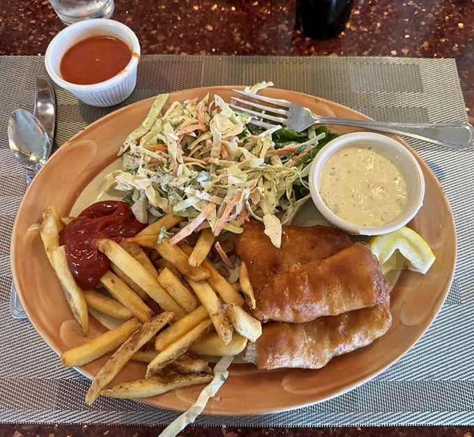 Fish so fresh it might have been swimming this morning, paired with crispy fries and a slaw that adds the perfect crunch factor.