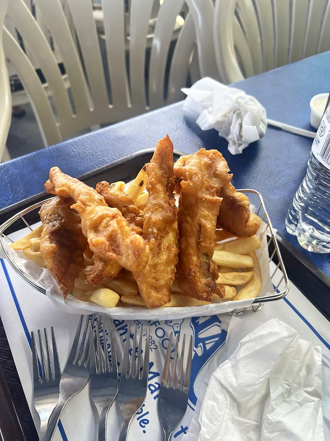 Fish and chips done right&mdash;golden, crispy, and served in a wire basket. No pretension, just perfection waiting to be devoured.