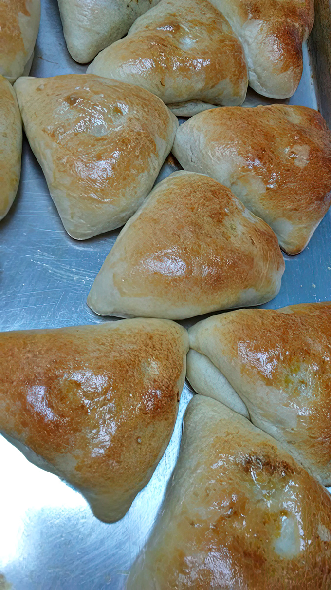 These golden-brown fish buns aren't just baked; they're architectural marvels of dough with the perfect crisp-to-soft ratio that would make Paul Hollywood weep.