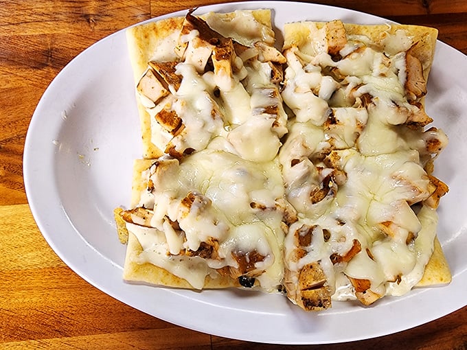 BBQ nachos that laugh in the face of ordinary appetizers, with cheese blanketing every morsel of smoky goodness.