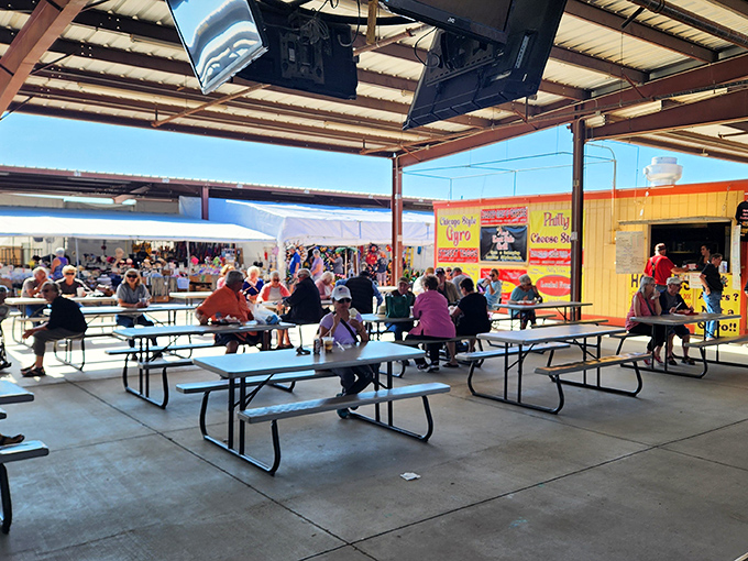The food court: where bargain hunters refuel and compare treasures under the desert sky, turning strangers into temporary tablemates.