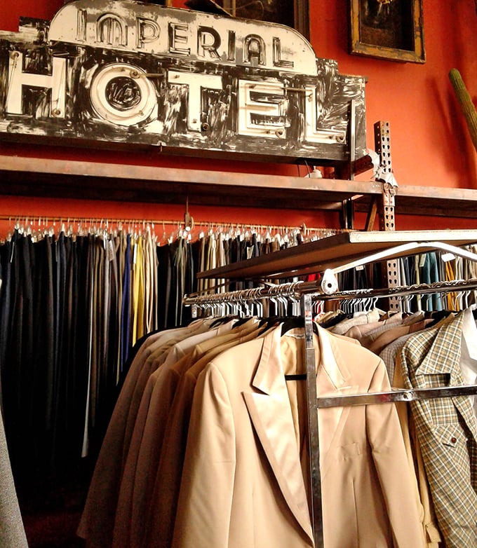 Beneath that vintage "Imperial Hotel" sign lies a collection of suits and jackets that would make Don Draper weep with sartorial joy.