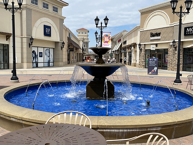 The blue fountain centerpiece&mdash;where wishes are tossed for designer finds at outlet prices, and tired feet get a moment's reprieve.