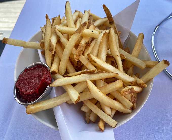 French fries so perfectly golden they deserve their own Instagram filter, served with a side of ketchup that's merely a suggestion.
