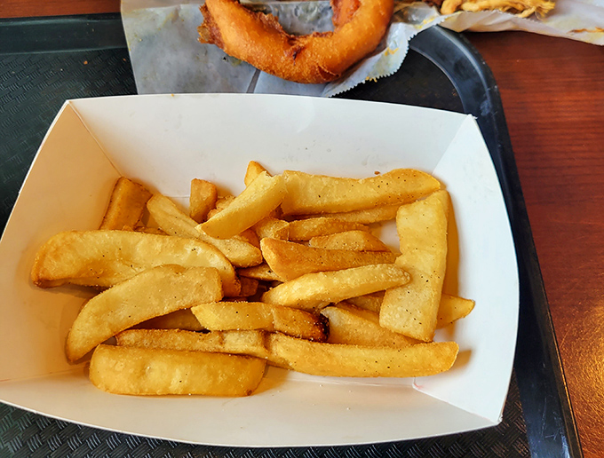 These aren't just French fries; they're the supporting actors that deserve their own Oscar&mdash;crisp, golden, and ready to soak up any wayward sauce.