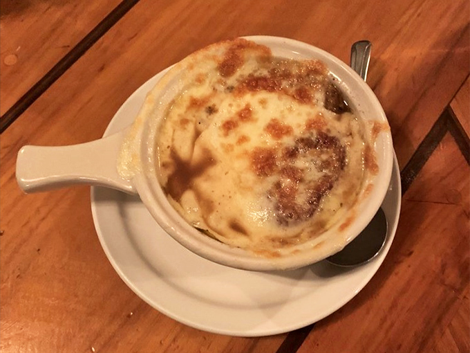 French onion soup topped with bubbling cheese &ndash; comfort food that warms both belly and soul on desert nights.