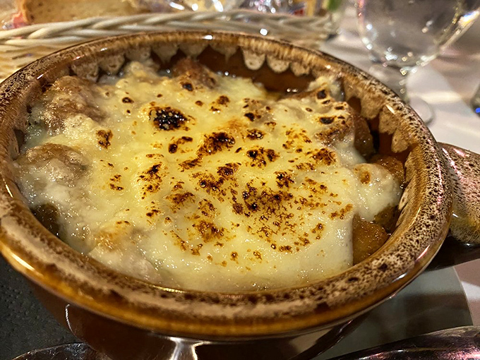 French onion soup that's equal parts comfort and decadence, with a cheese pull that deserves its own slow-motion sequence.