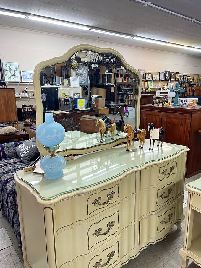 The elegant cream dresser with blue lamp could star in a Nancy Meyers film&mdash;coastal grandmother aesthetic at yard sale prices.