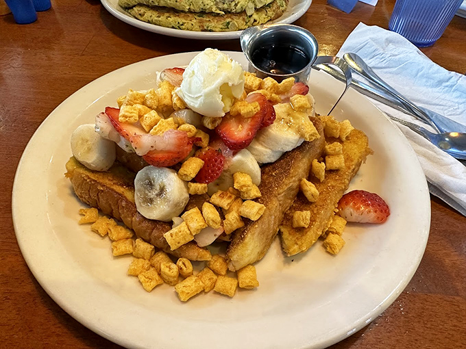French toast that's dressed for success, topped with fresh fruit and what appears to be Captain Crunch&mdash;breakfast cereal making a cameo as a topping star.