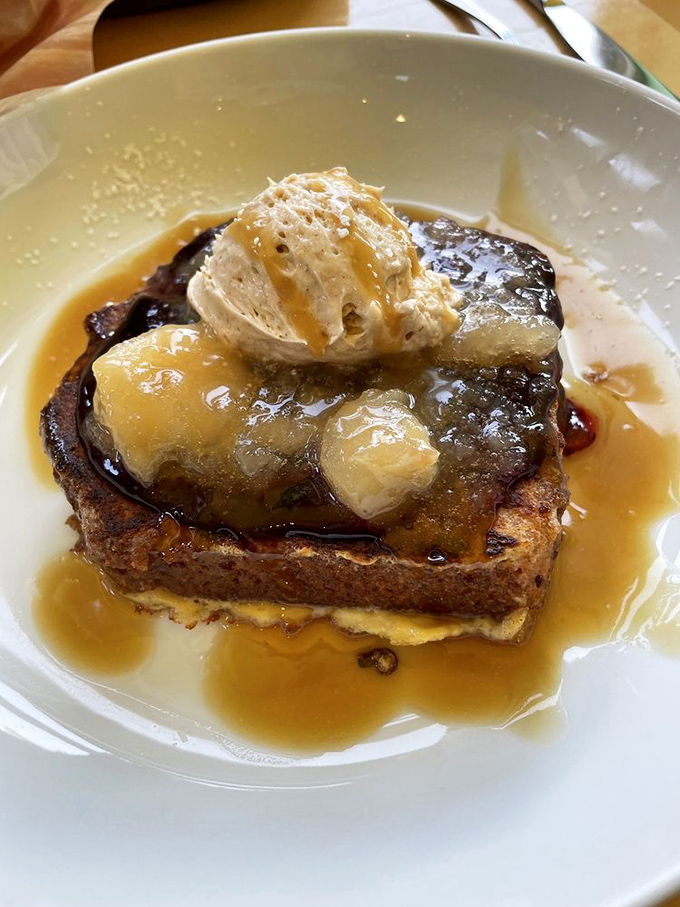 French toast that makes pancakes jealous. Topped with caramelized fruit and a dollop of cream, it's the breakfast equivalent of hitting the lottery.