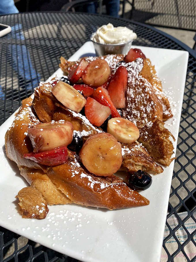 French toast that makes you question every other breakfast decision you've ever made. Fresh fruit and powdered sugar transform bread into morning magic.