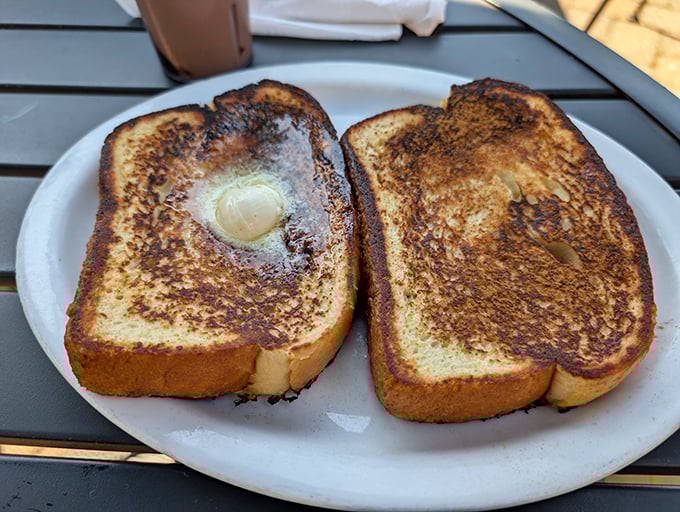 French toast that's achieved that magical alchemy&mdash;crispy exterior, custardy interior. The butter melting in the center is nature's way of saying "good morning."