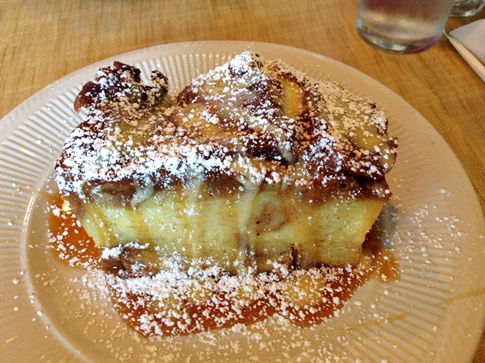 This isn't just French toast &ndash; it's what French toast dreams of becoming when it grows up. The powdered sugar snowfall is just showing off.