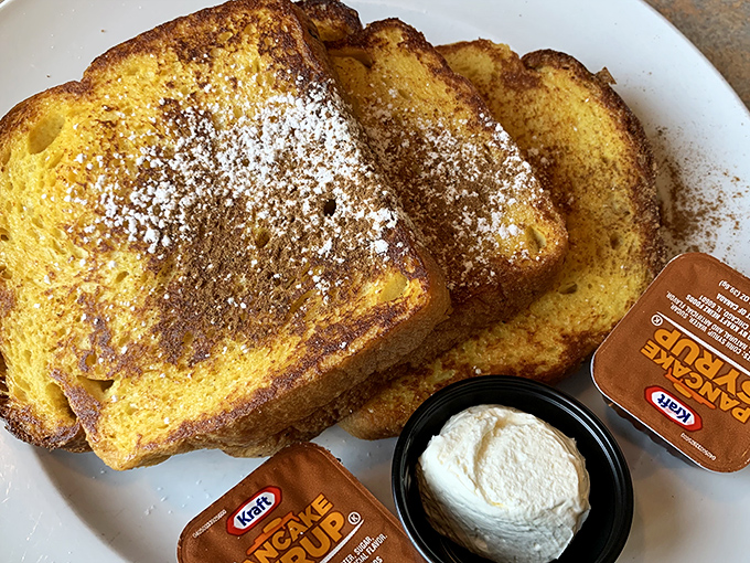 French toast that's achieved the golden-brown perfection we all attempt at home but rarely achieve. The powdered sugar is just showing off.