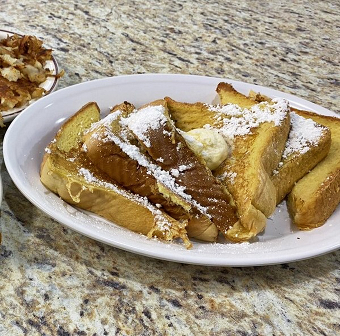 Golden-brown French toast dusted with powdered sugar &ndash; the kind that makes you wonder why you ever eat anything else for breakfast.