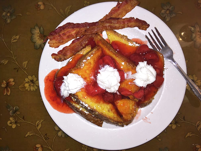Strawberry-topped French toast with a side of perfectly fried chicken—because sometimes breakfast needs to satisfy both your inner child and adult simultaneously.