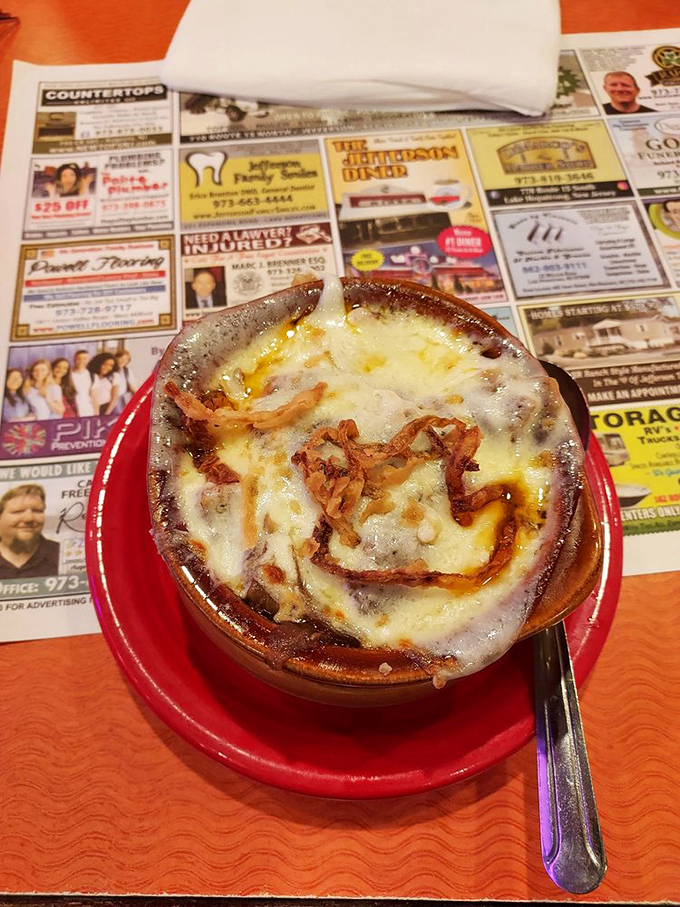 The legendary French onion soup arrives like a bubbling cauldron of cheese-topped bliss. Worth every stringy, messy, magnificent bite.