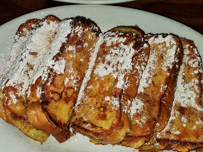French toast that's achieved celebrity status. Dusted with powdered sugar like fresh snow on a delicious landscape of custard-soaked bread.