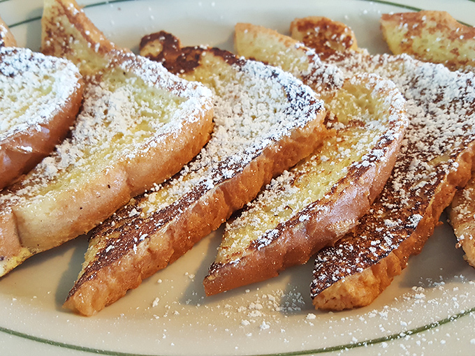 French toast dusted with powdered sugar like a winter wonderland on your plate. Breakfast or dessert? Why choose when you can have both?