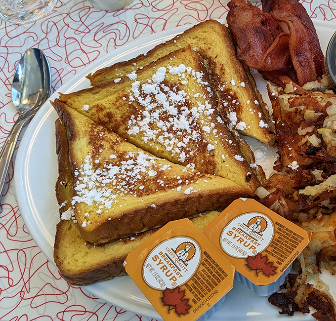French toast dusted with powdered sugar, crispy bacon, and hash browns—the breakfast trifecta that never disappoints anyone, ever.