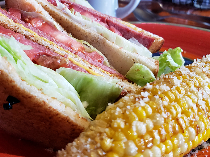 A sandwich that doesn't need to show off—it knows exactly what it is. Fresh bread, quality ingredients, and that corn on the cob looking like summer's perfect sidekick.