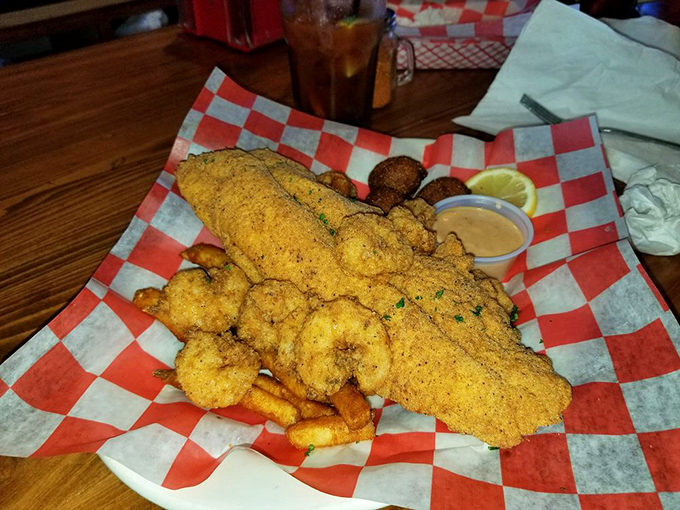 Cornmeal-crusted catfish and shrimp served on checkered paper&mdash;proof that the best Southern comfort doesn't need fancy china to change your life.