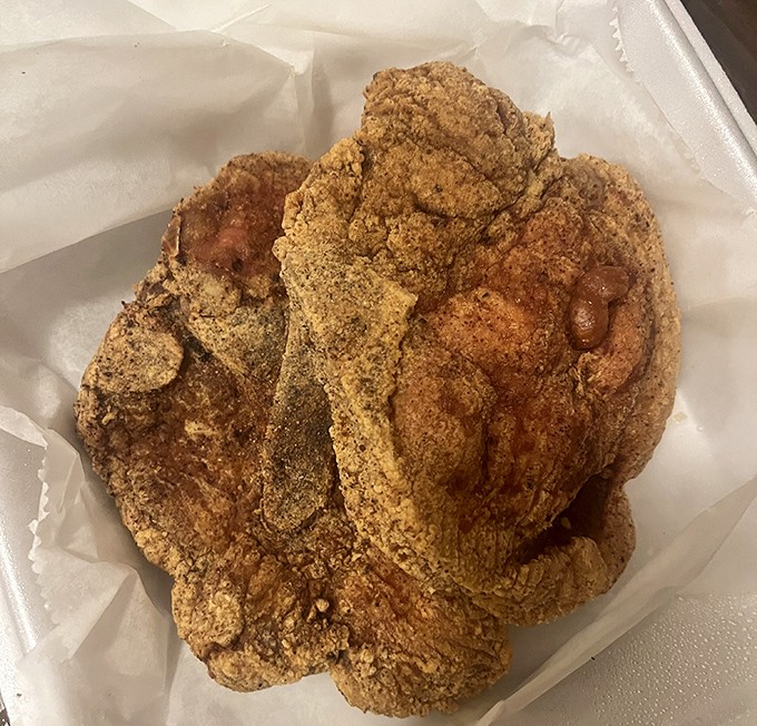 Cornmeal-crusted fried chicken that makes you question every other version you've ever had&mdash;crispy, seasoned perfection protecting juicy meat within.