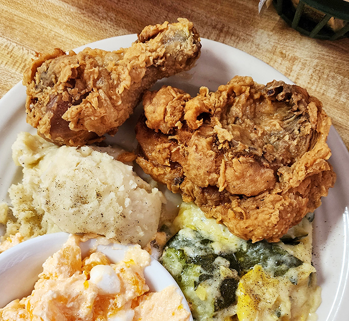 Fried chicken that would make your grandmother both proud and jealous, paired with sides that refuse to be mere afterthoughts.