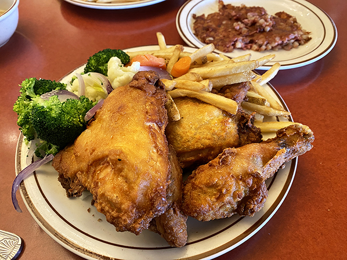 Golden-fried chicken that crackles with each bite, paired with fries that could make a French chef question their life choices.