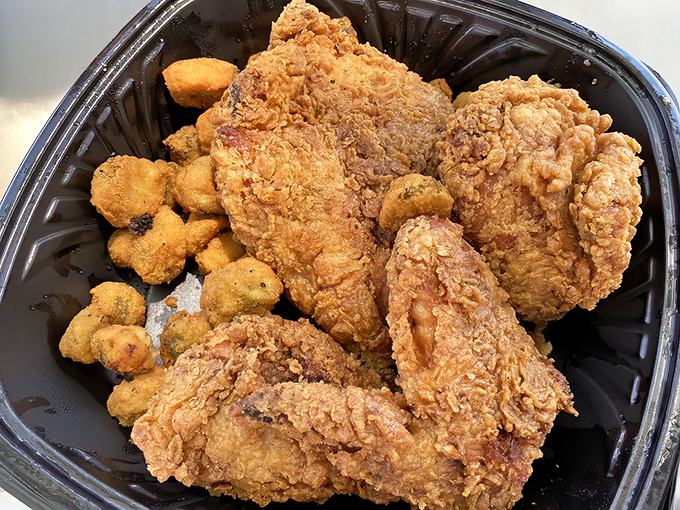 Fried chicken that would make your grandmother both jealous and proud. The golden crust whispers secrets of perfectly seasoned batter.
