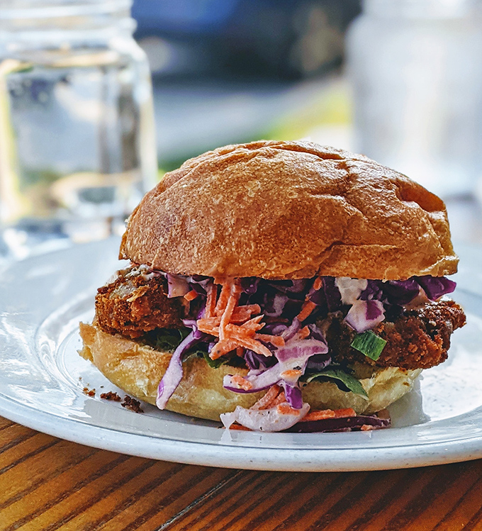 The fried chicken sandwich defies physics &ndash; crispy, succulent, and completely plant-based. Some mysteries are better left unsolved.