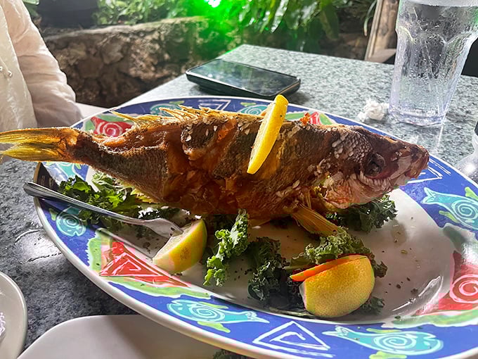 A whole fish, perfectly fried and presented with artistic flair. The kind of dish that makes you want to applaud when it arrives.