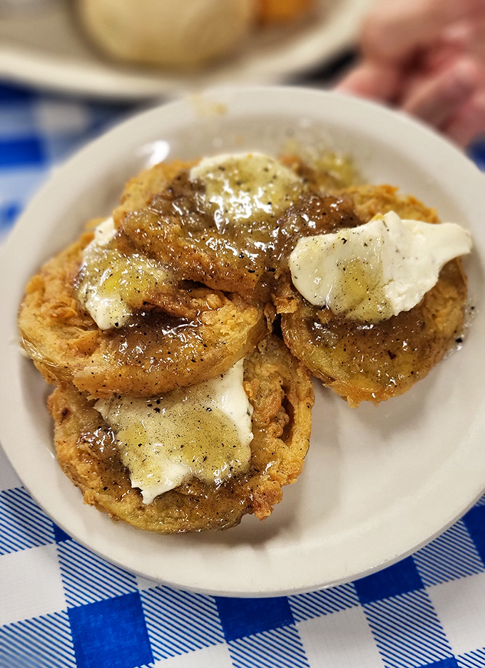 Open-faced biscuits drowning in gravy represent everything right with the world, especially when breakfast is involved daily.