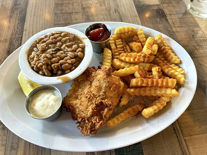 Crispy on the outside, flaky perfection inside &ndash; this fried fish plate with beans and fries is comfort food that would make a Bostonian homesick.