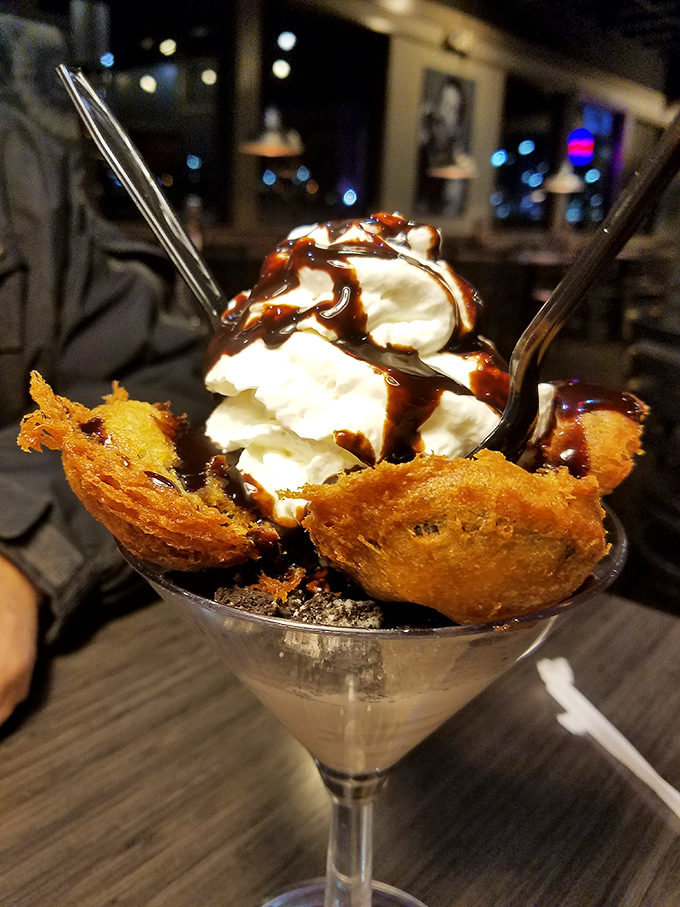 Dessert innovation at its finest: fried ice cream nestled in a crispy shell, topped with whipped cream—proof that opposites really do attract.