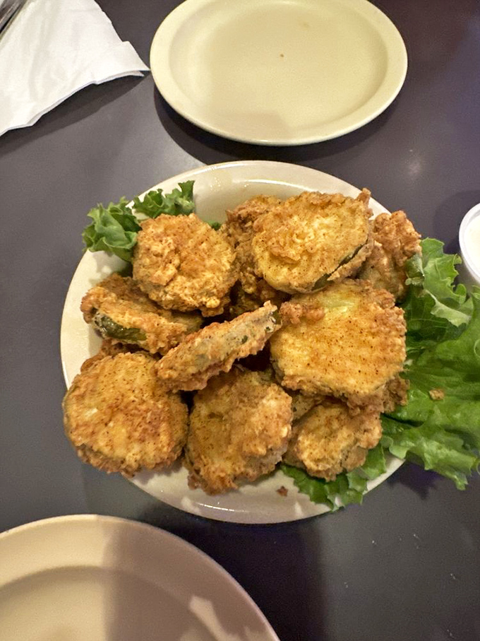 Golden-fried pickle chips that shatter with each bite &ndash; the perfect tangy counterpoint to a hearty burger.