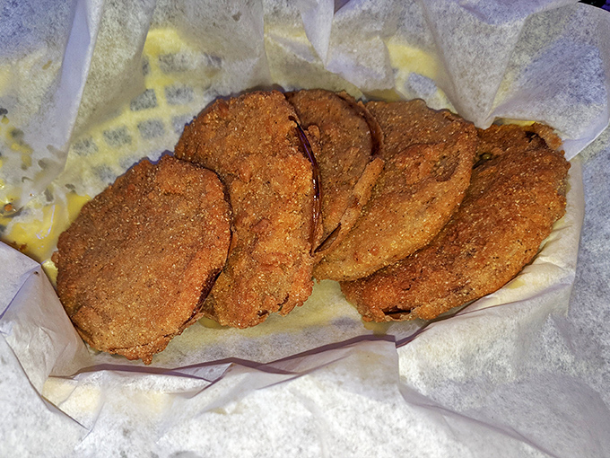 Fried pickles stacked like crispy green poker chips, ready to ante up your taste buds for the main event.
