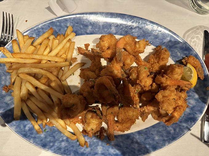 Fried shrimp that achieve the impossible: delicately crisp exteriors protecting sweet, succulent interiors. The French fries aren't bad company either.