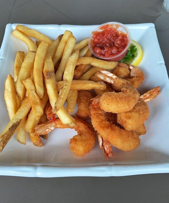 Golden-fried Gulf shrimp that snap between your teeth, paired with hand-cut fries and a dipping sauce worth bottling and taking home.