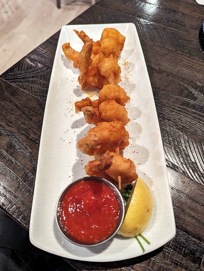 These golden-fried shrimp aren't just appetizers&mdash;they're the opening act for a seafood concert. Crispy, plump, and ready for their cocktail sauce companion.