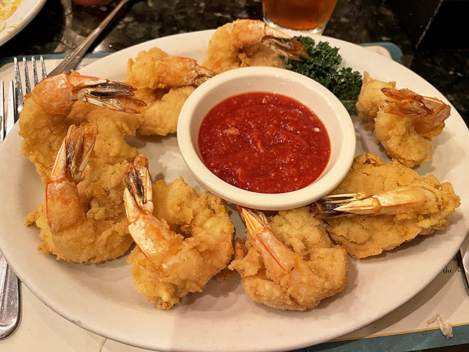 Golden-fried jumbo shrimp that crunch like nature's perfect potato chip, served with a sauce that demands to be the center of attention.