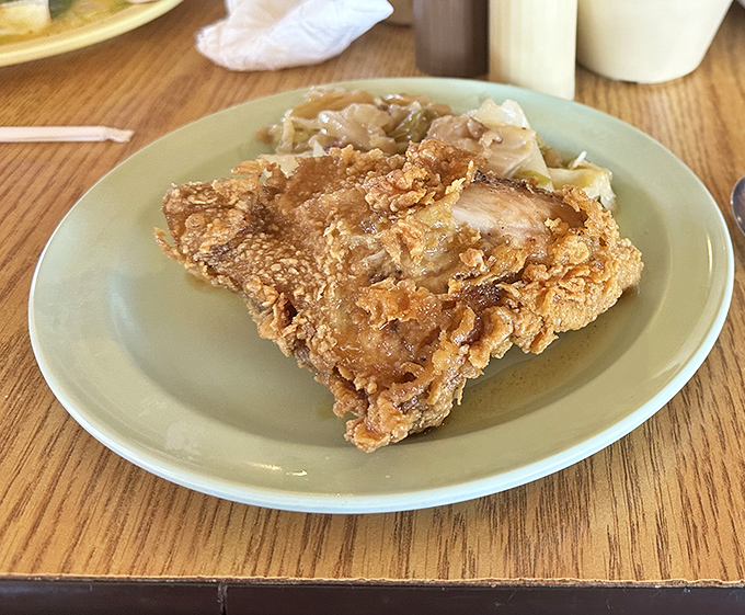 Fried chicken with a crust so perfect it should have its own Instagram account—crispy, seasoned, and worthy of a standing ovation.