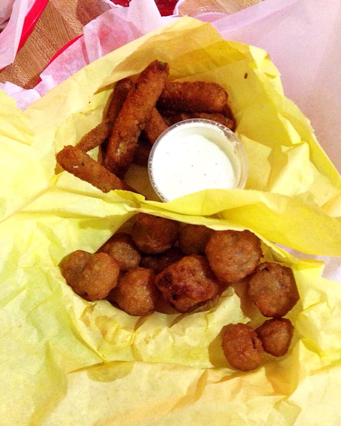 Golden-fried mushrooms and zucchini &ndash; proof that vegetables can have fun too when properly introduced to hot oil.