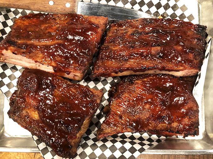 These ribs don't just fall off the bone—they practically leap onto your plate with a glossy coat of sauce that's the perfect balance of sweet and tang.