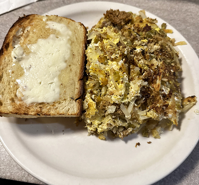 Behold the legendary Garbage Plate! Hash browns and eggs performing a beautiful dance with veggies and cheese that would make Fred Astaire jealous.