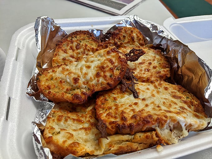 Garlic cheese bread that's been blessed by the carbohydrate gods and emerged golden, crispy, and utterly irresistible from above.