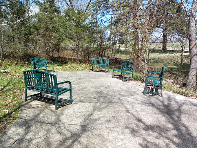 These teal benches form a conversation circle where hikers can rest their legs while debating life's important questions, like "How did Oklahoma hide this place for so long?"
