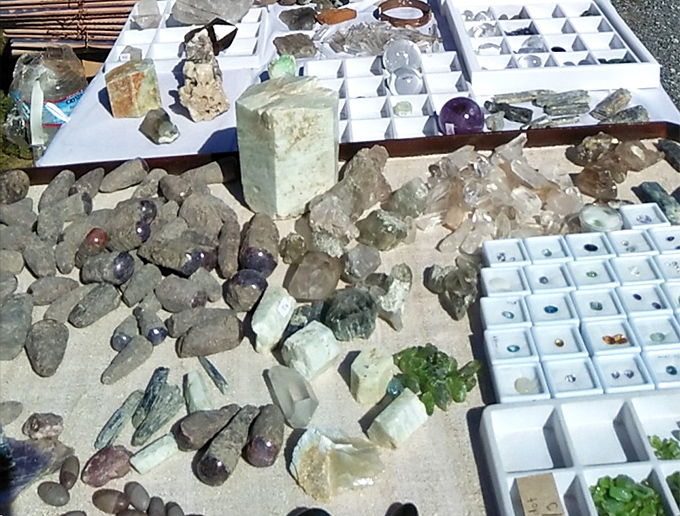 Gemstones and crystals sprawl across tables, offering enough mystical energy to power your chakras or just look really cool.