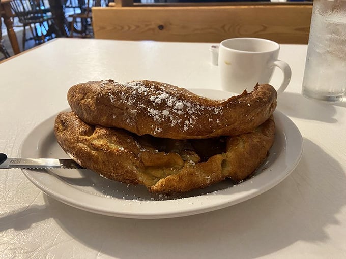 The German apple pancake rises like a souffl&eacute;'s confident cousin&mdash;golden, proud, and dusted with sugar that melts into every heavenly bite.